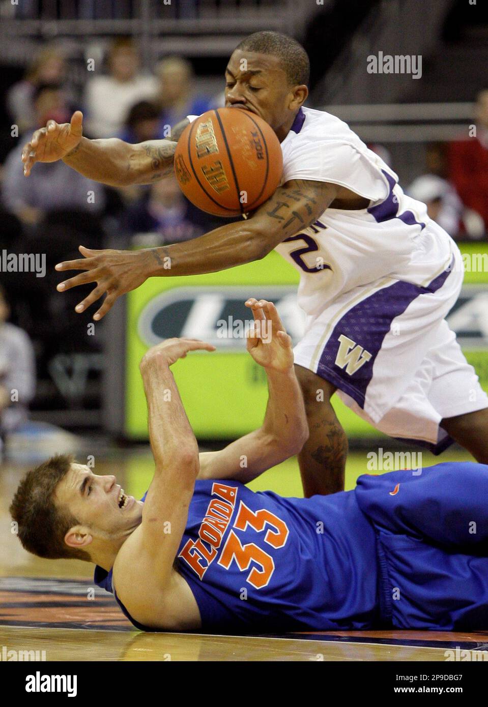 Florida guard Nick Calathes (33) and Washington guard Isaiah Thomas (2 ...
