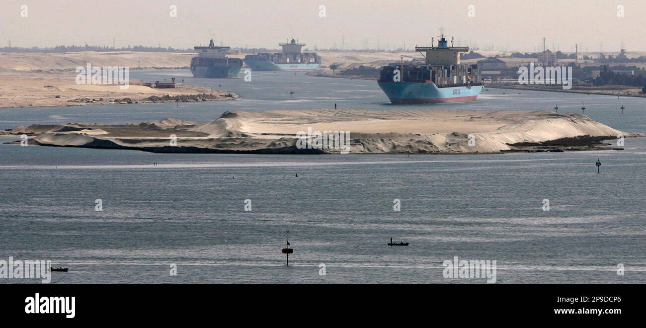 Cargo ships are seen going through the Suez Canal towards the Red Sea ...