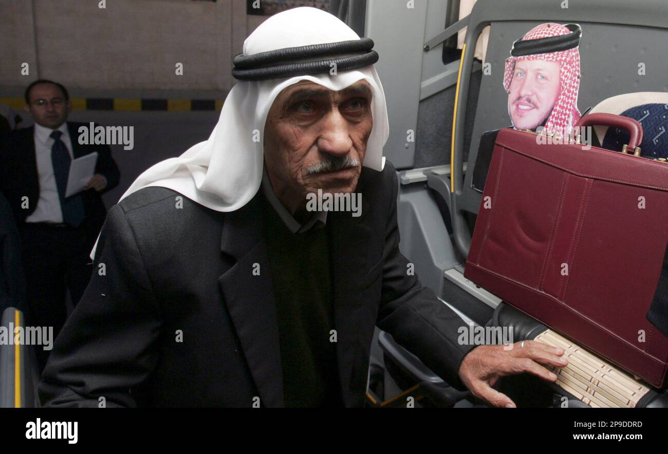 Family members of Jordanian prisoners in Israeli get on buses at the ...