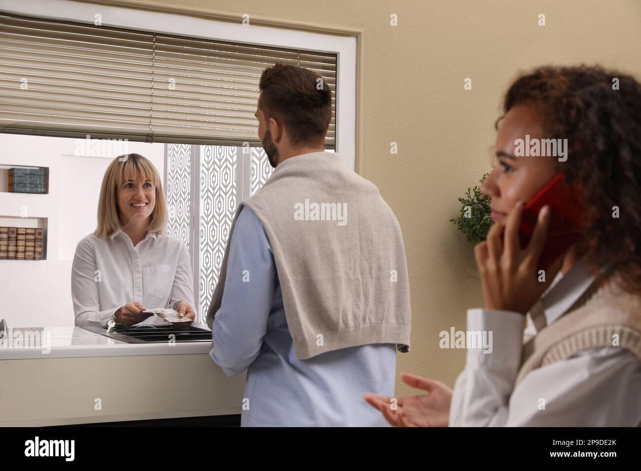 Man receiving money at cash department window in bank. Currency ...