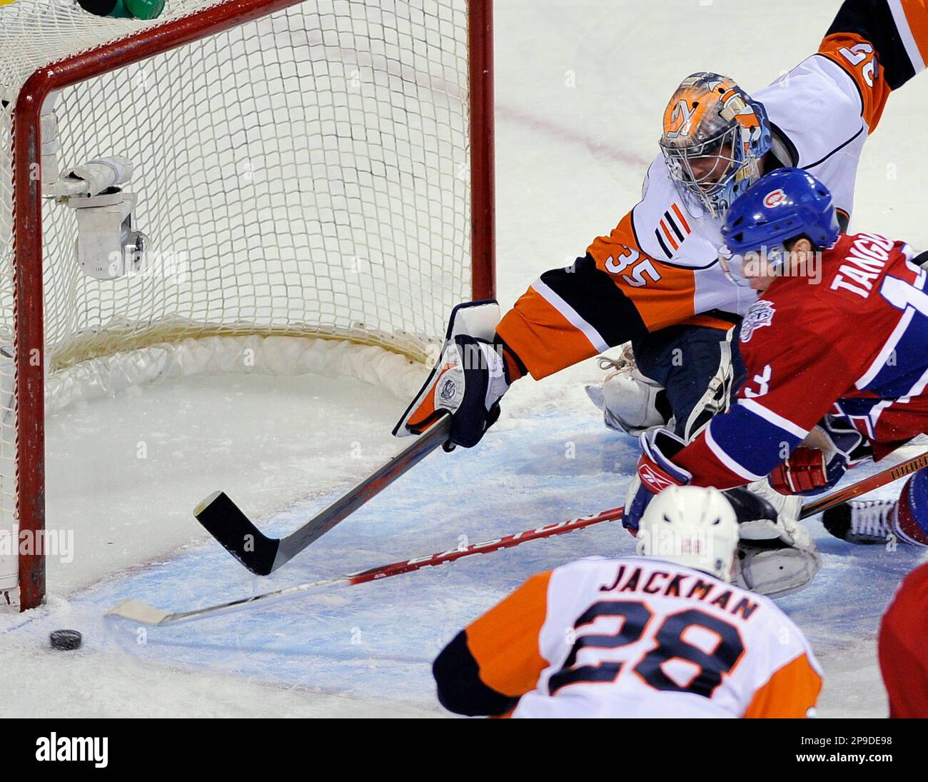 New York Islanders goaltender Joey MacDonald (35) makes a save on ...