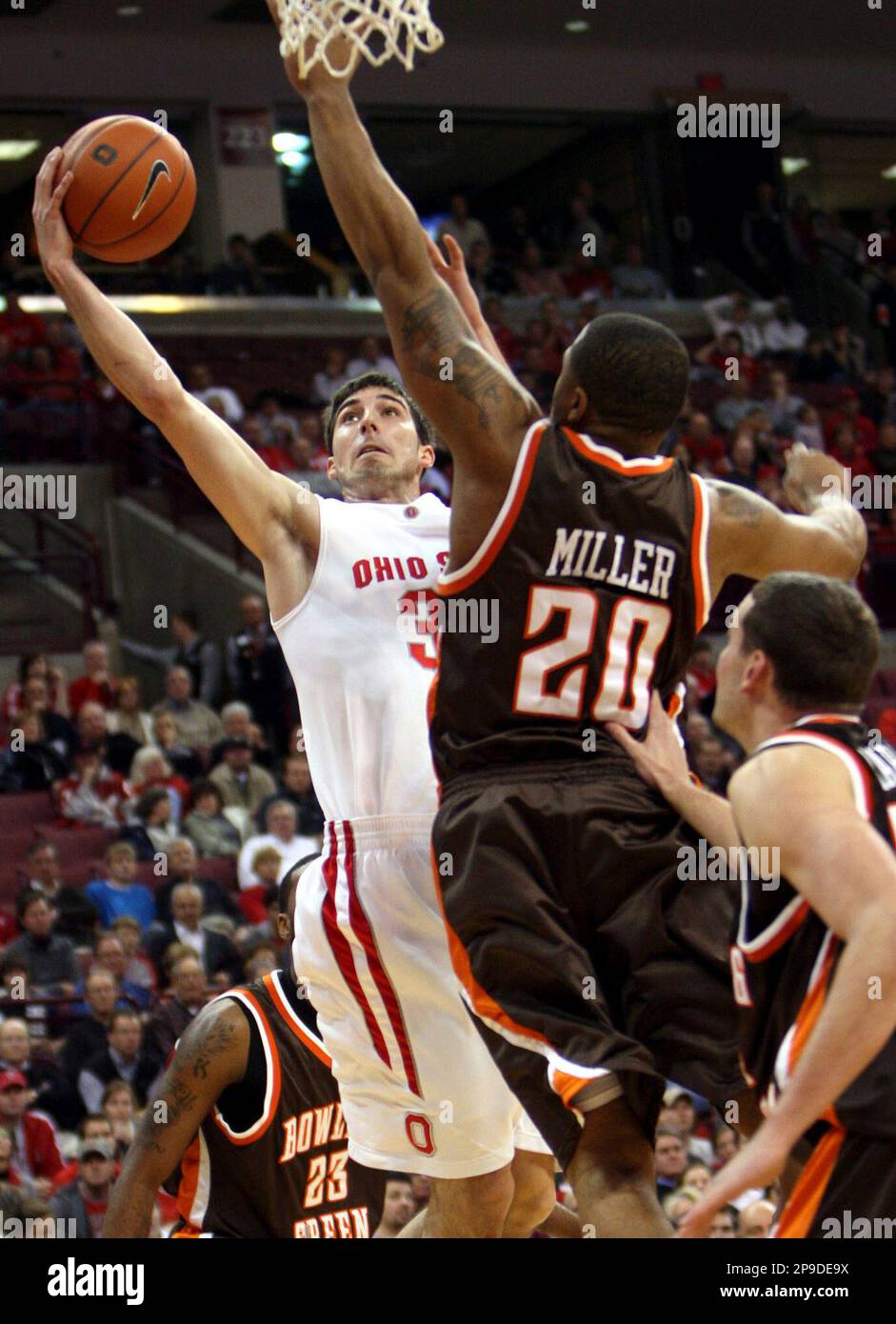 Ohio State's Jon Diebler, left, goes up for two over Bowling Green's ...