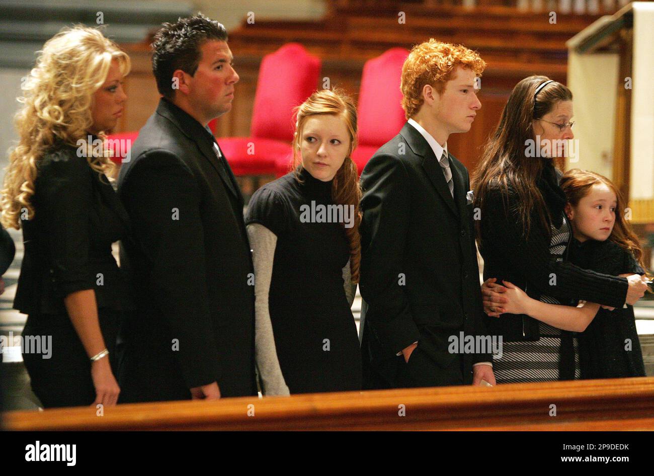 Police Sgt. Timothy Simpson family members, from left, stepson Michael ...