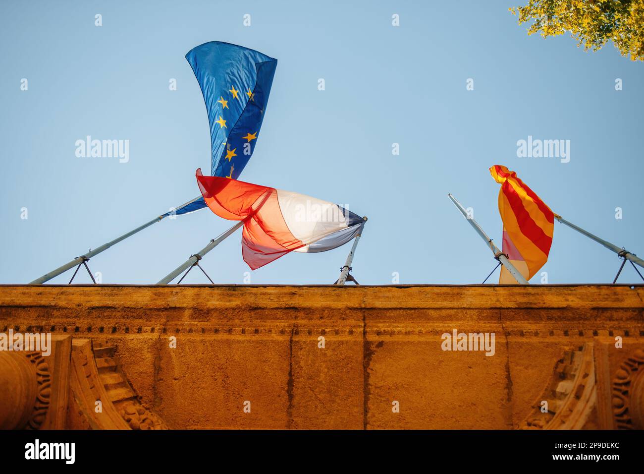 View from below of French national Flag, next to European Union and ...