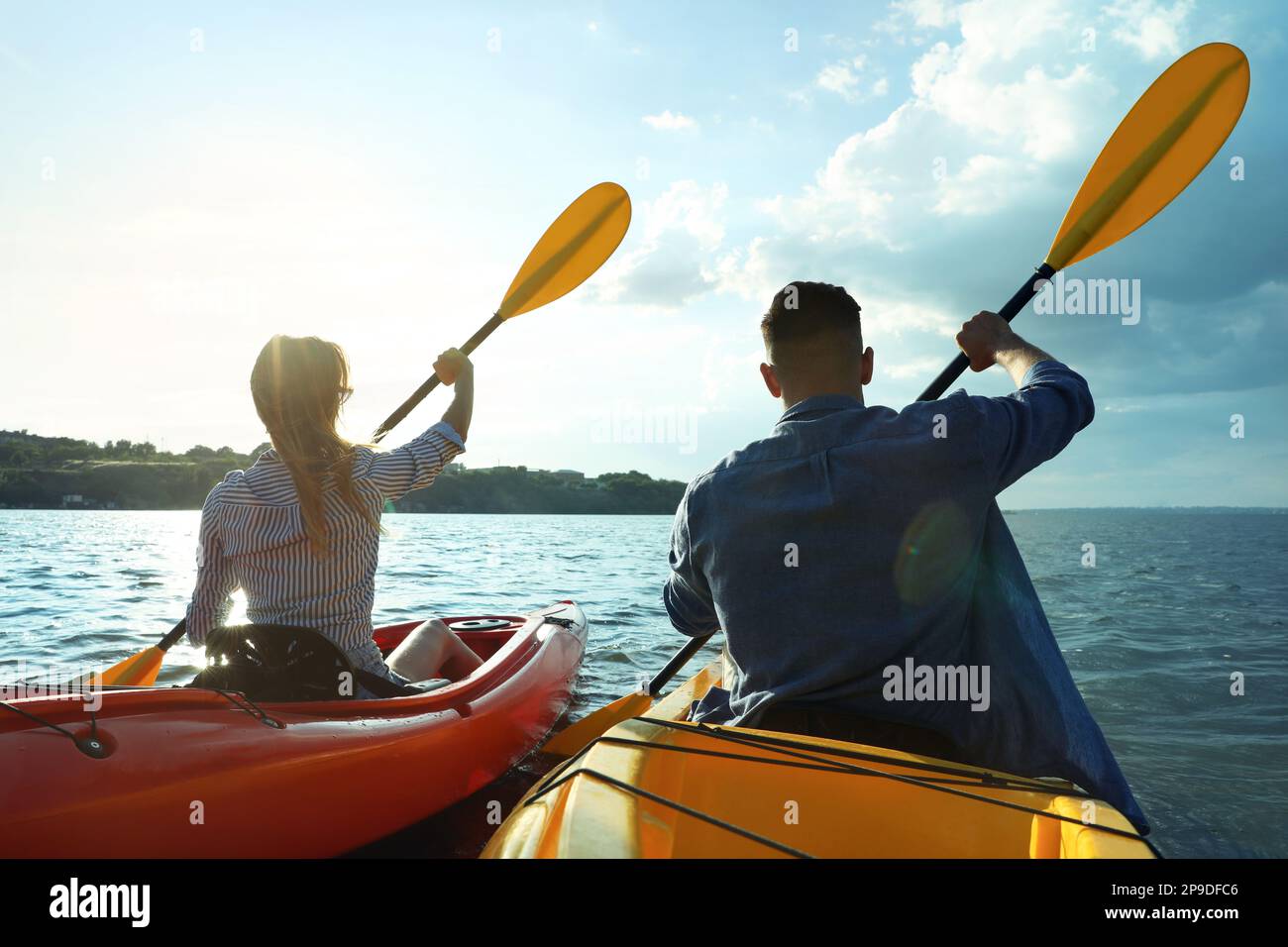 Beautiful couple kayaking on river, back view. Summer activity Stock ...