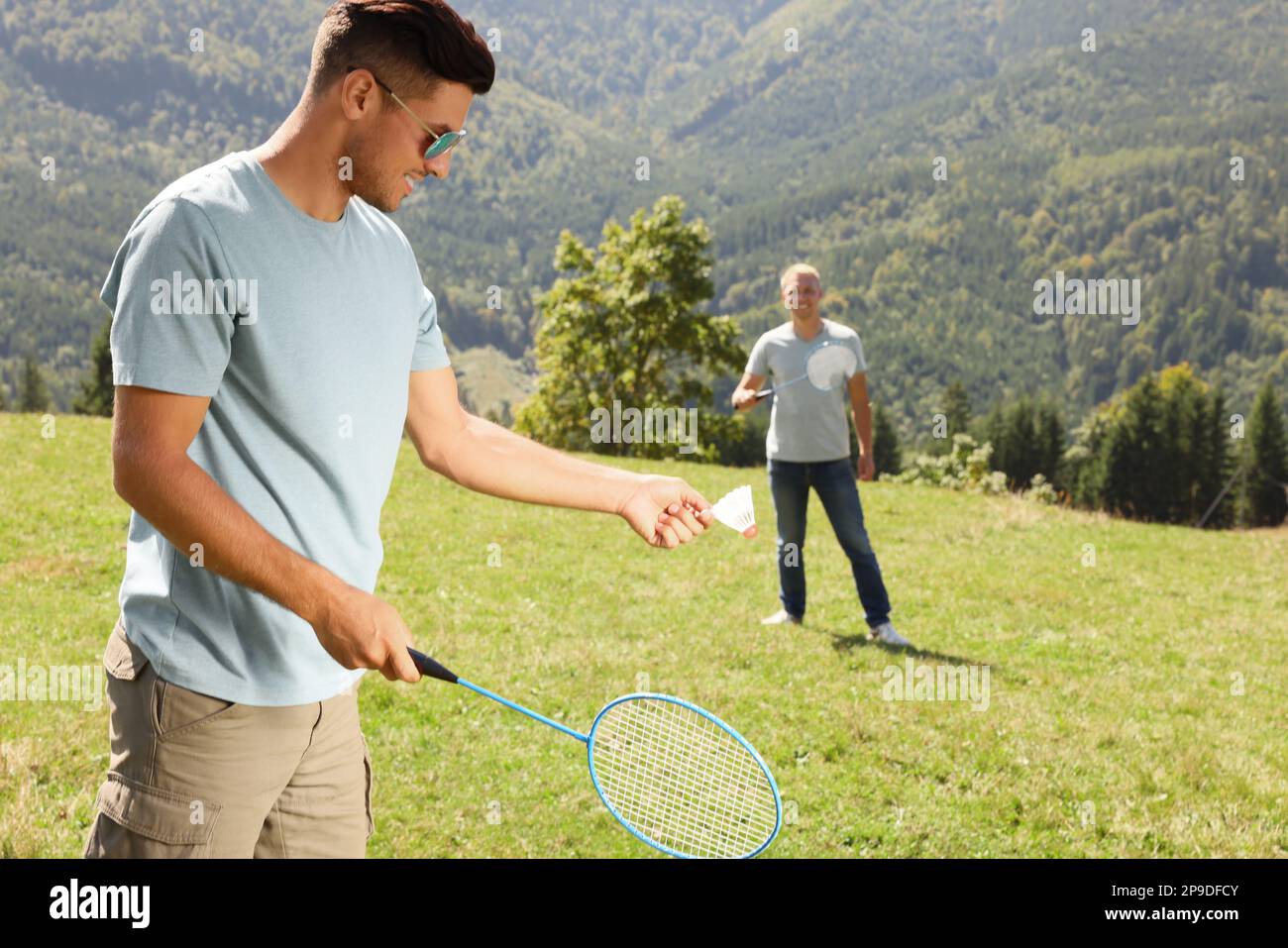 Friends playing badminton hi-res stock photography and images - Alamy
