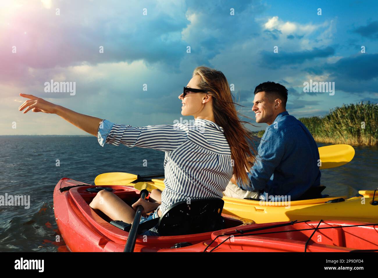 Beautiful couple kayaking on river. Summer activity Stock Photo - Alamy