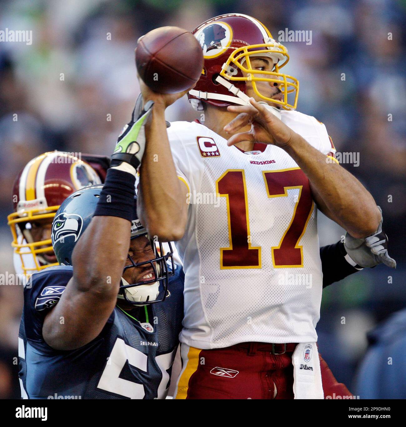 Seattle Seahawks' Darryl Tapp, left, sacks Washington Redskins ...