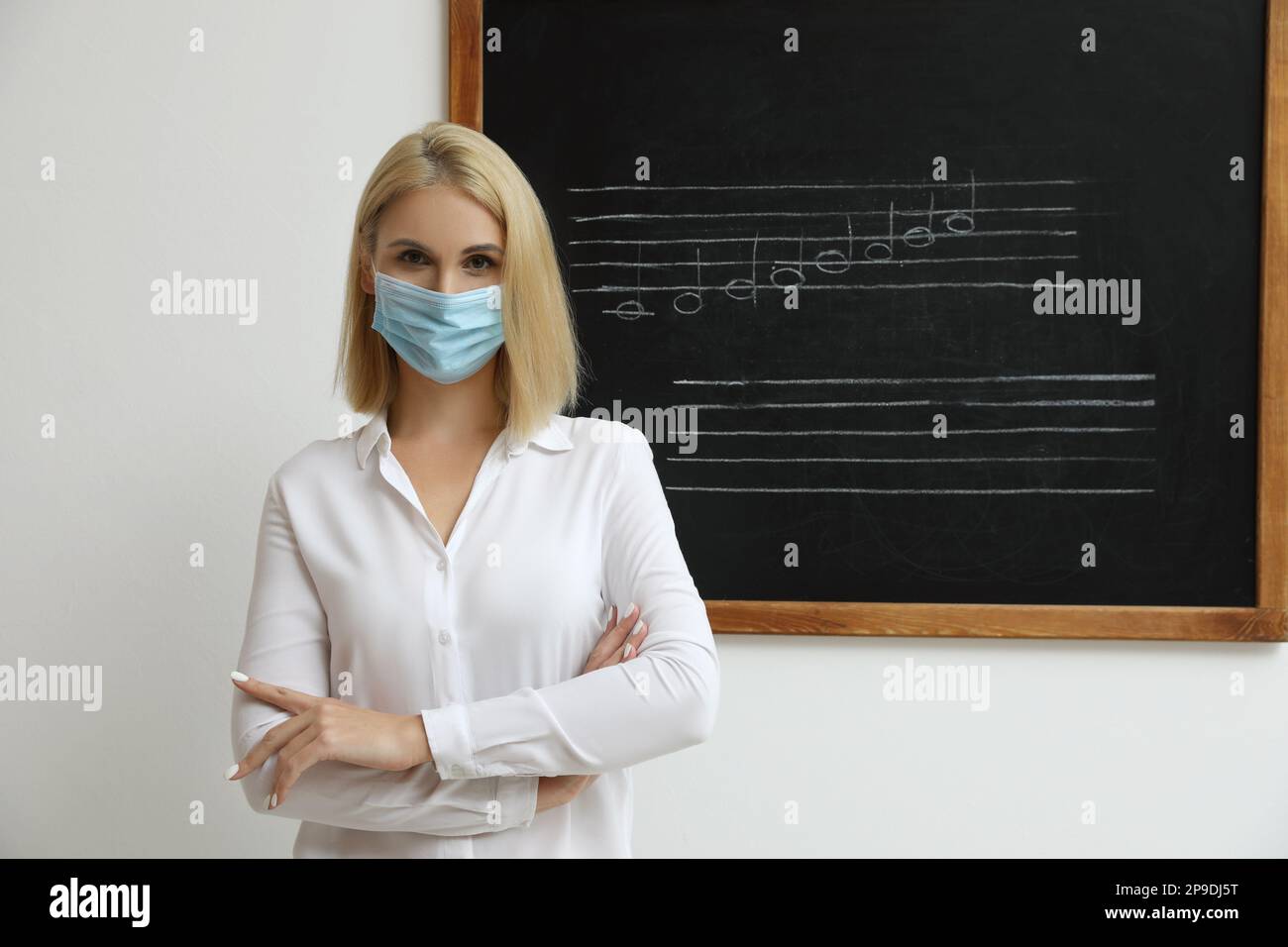 Female teacher wearing face mask hi-res stock photography and images ...