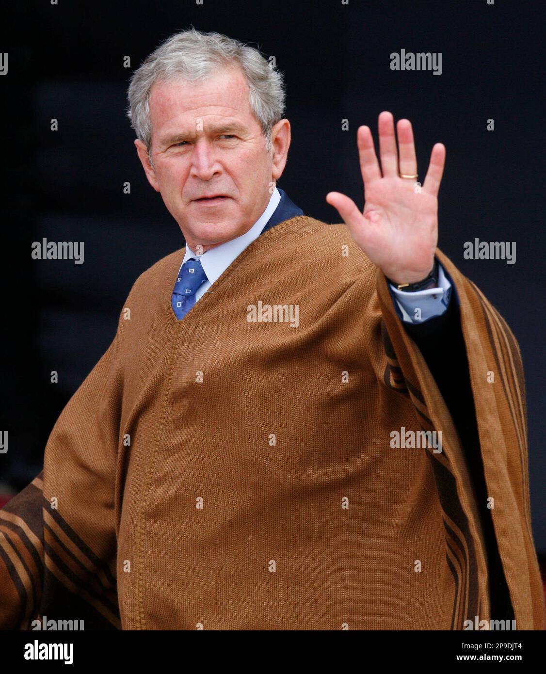 US President George W. Bush, wearing a traditional Peruvian poncho ...