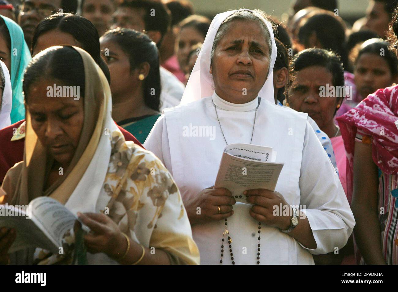 Catholic nuns chant hymns during Corpus Christi, or a Christian feast ...