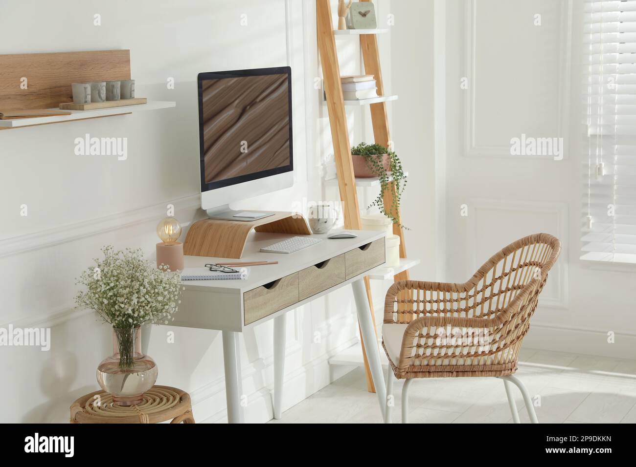 Comfortable workplace with modern computer and lamp in room. Interior ...