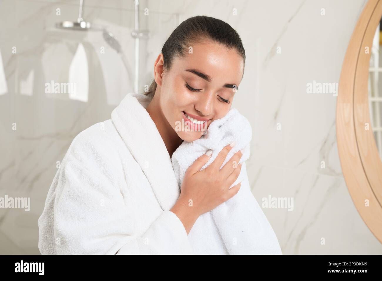 Woman wiping face with towel hi-res stock photography and images - Alamy