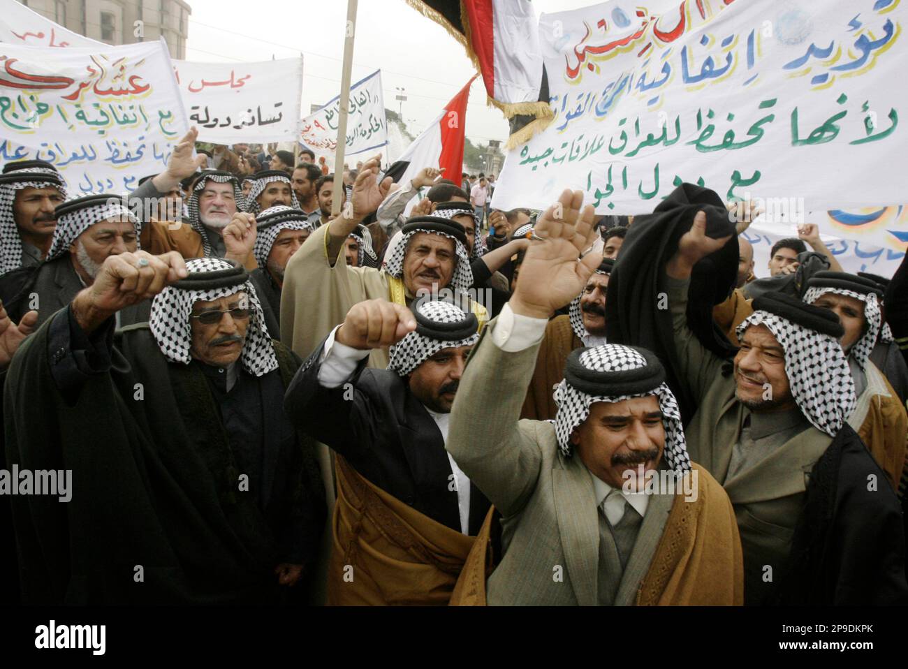 Iraqi men chant slogans during a demonstration in support of a U.S ...