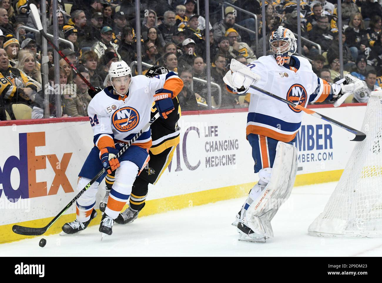New York Islanders defenseman Scott Mayfield (24) moves the puck past ...