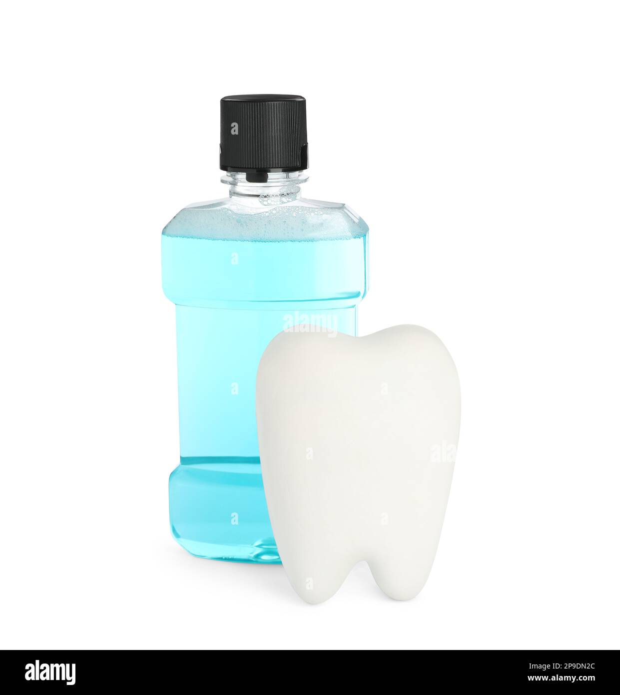 Tooth shaped holder and mouthwash on white background Stock Photo - Alamy