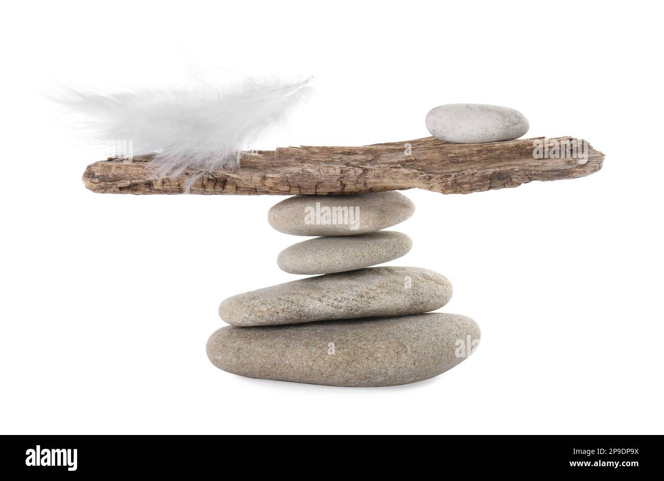 Stack of stones with tree branch and feather on white background ...