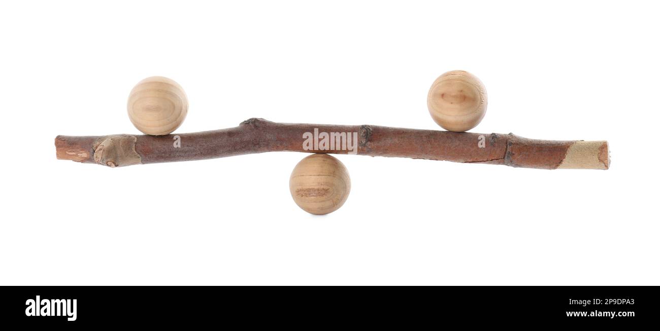 Tree branch with wooden balls on white background. Harmony and balance ...