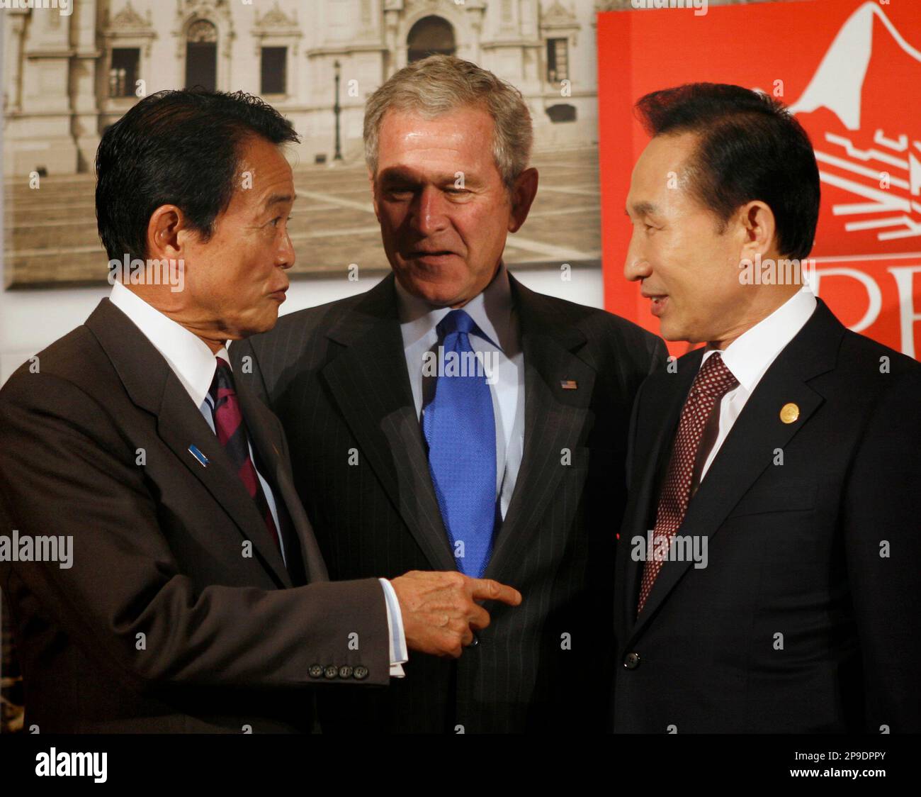 U.S. President George W. Bush, center, with Prime Minister Taro Aso of ...