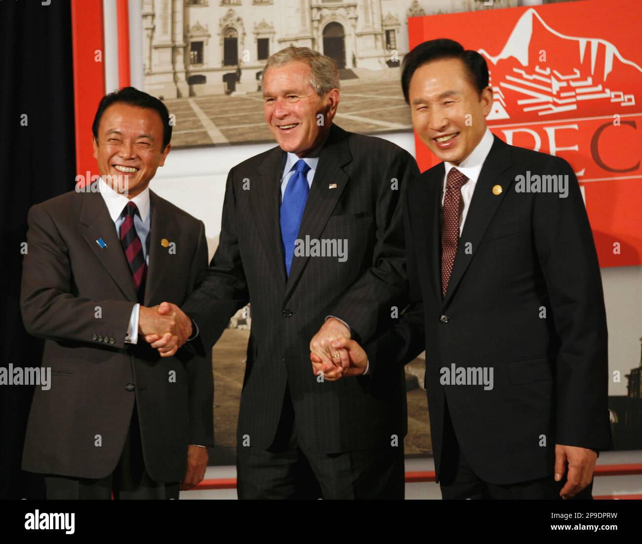 U.S. President George W. Bush, center, with Prime Minister Taro Aso of ...