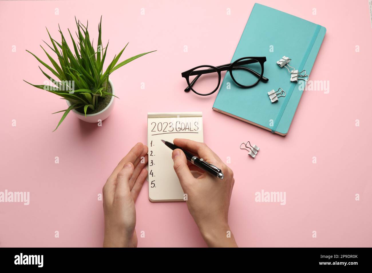 Woman writing in notebook on hi-res stock photography and images - Alamy