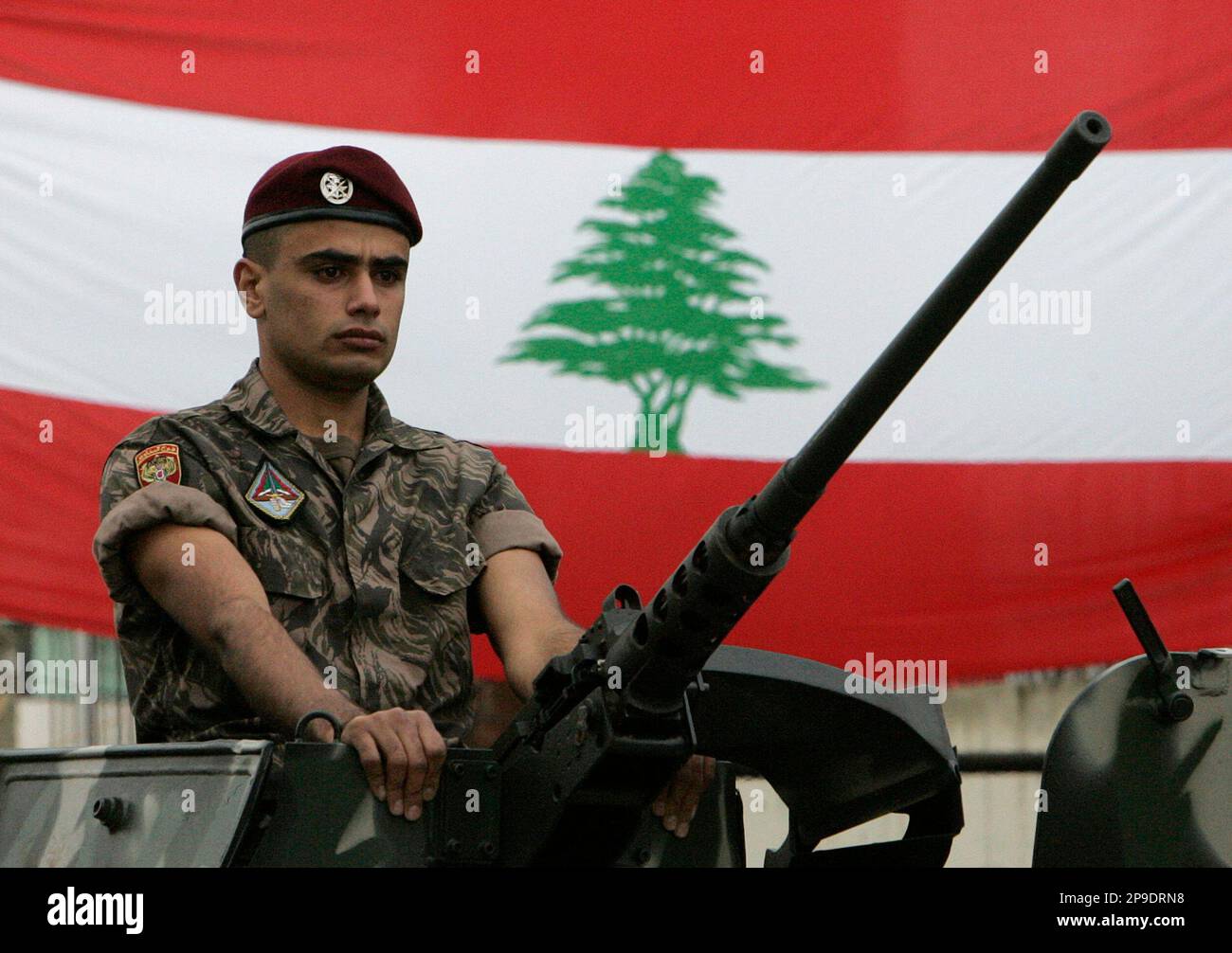A Lebanese soldier sits atop an armoured personnel carrier during a ...