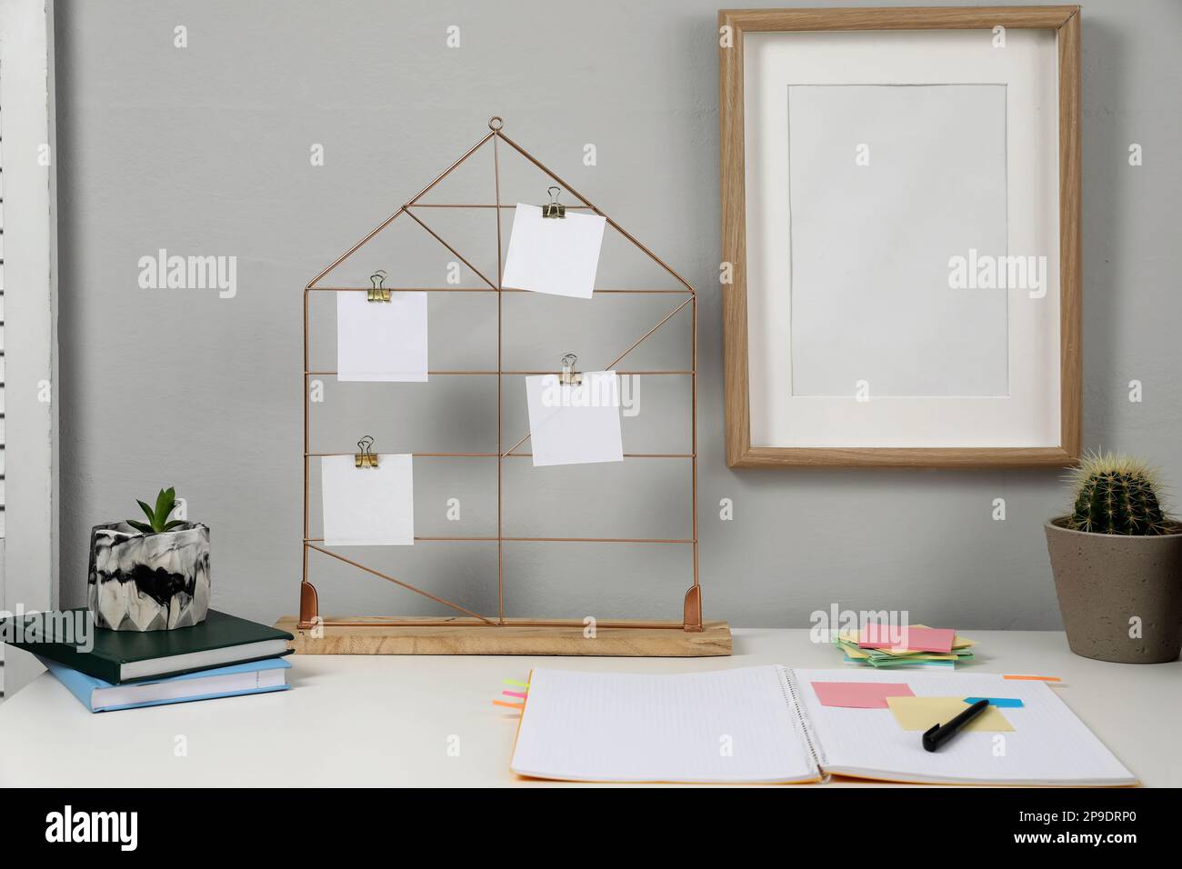 Memo board with notes on table in home office Stock Photo - Alamy