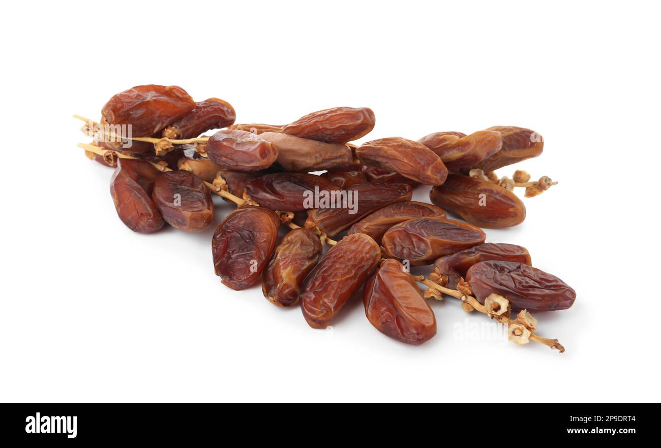 Sweet dates on branches against white background. Dried fruit as ...