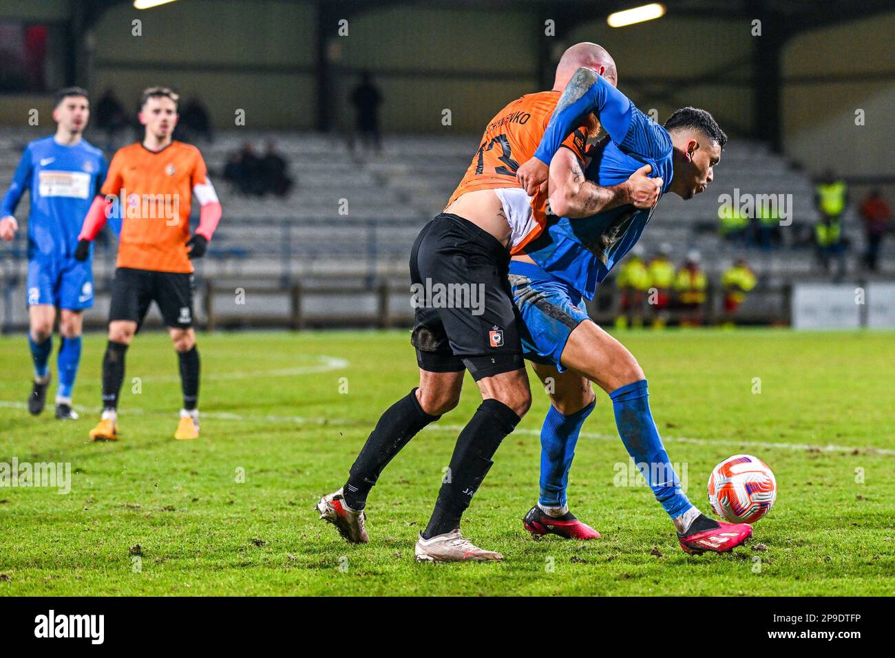 Denis Prychynenko (13) of KMSK Deinze and Zakaria Atteriv (17) of ...
