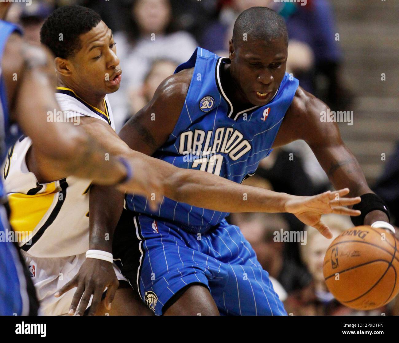 Orlando Magic guard Mickael Pietrus right,, of France, is defended by ...