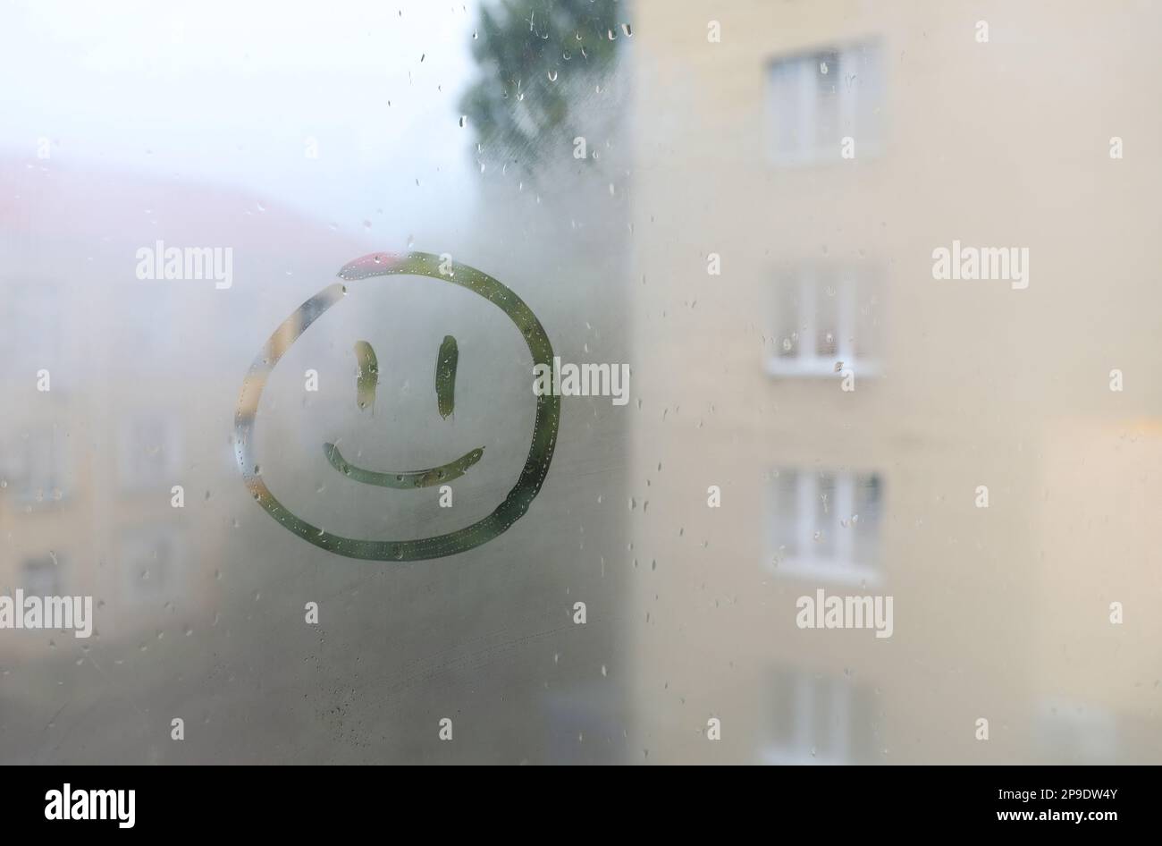 Funny face drawn on foggy window, space for text. Rainy weather Stock ...