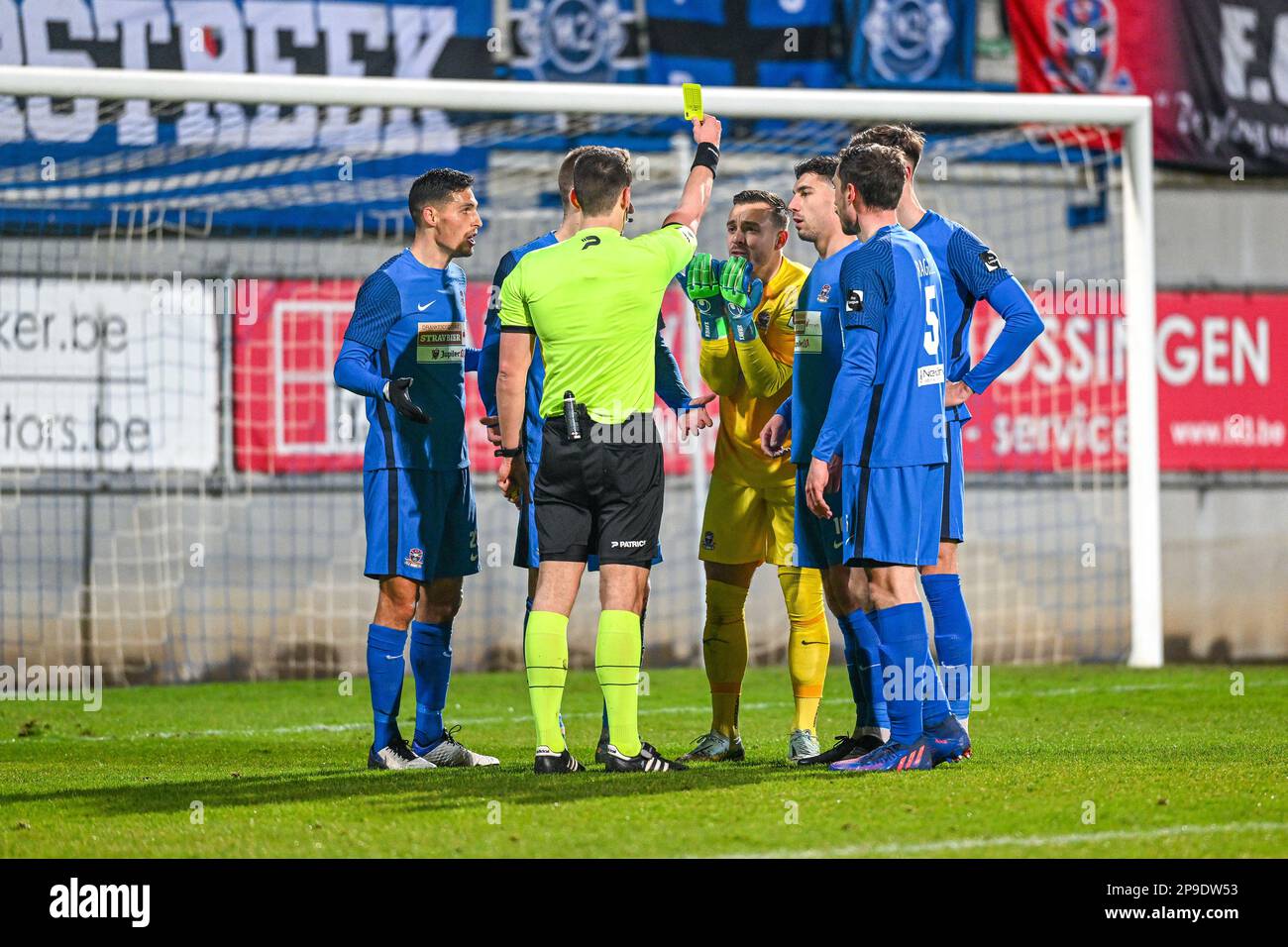 yellow card for goalkeeper Xavier Gies (1) of Dender pictured during a ...