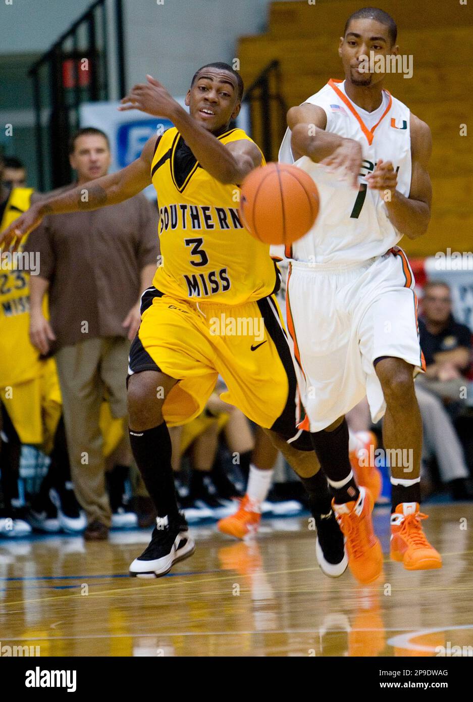 Miami's Lance Hurdle, right, makes a pass with Southern Mississippi's ...