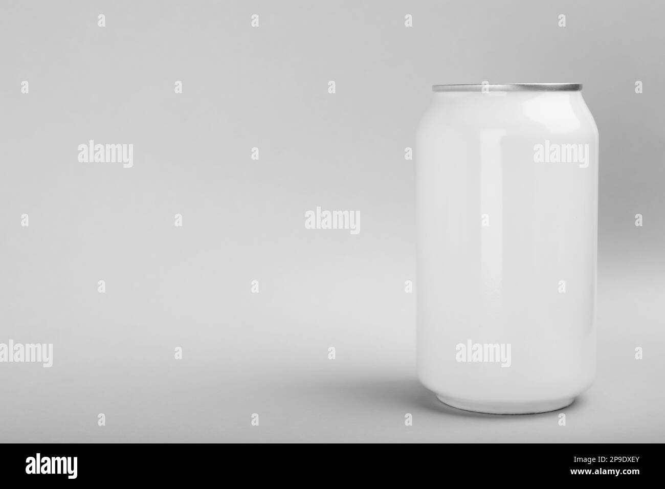 White can of energy drink on light grey background. Space for text ...