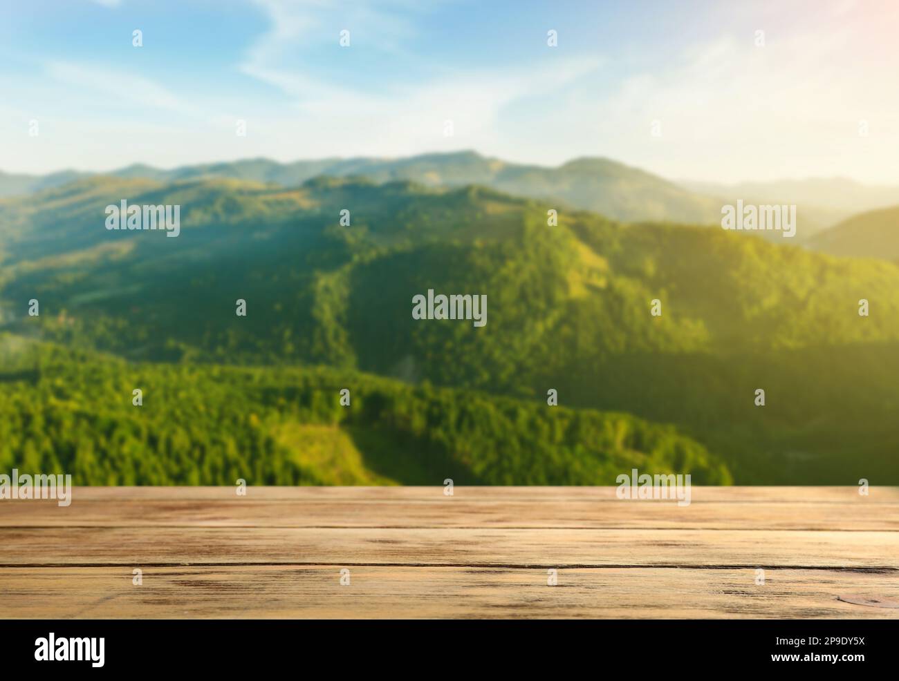 Empty wooden surface and beautiful view of mountain landscape on sunny ...