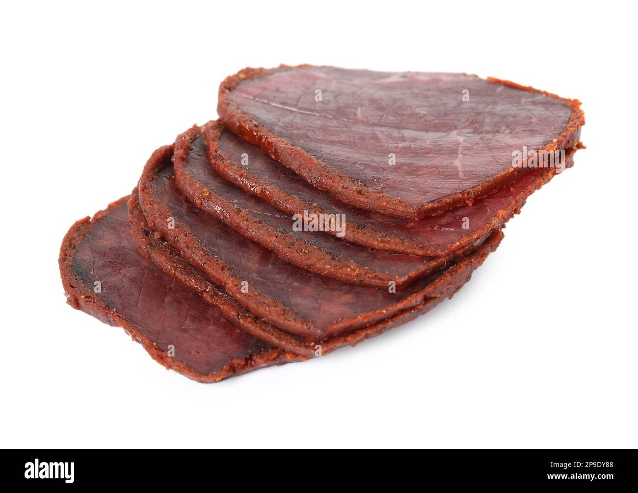 Delicious dry-cured beef basturma slices on white background Stock ...