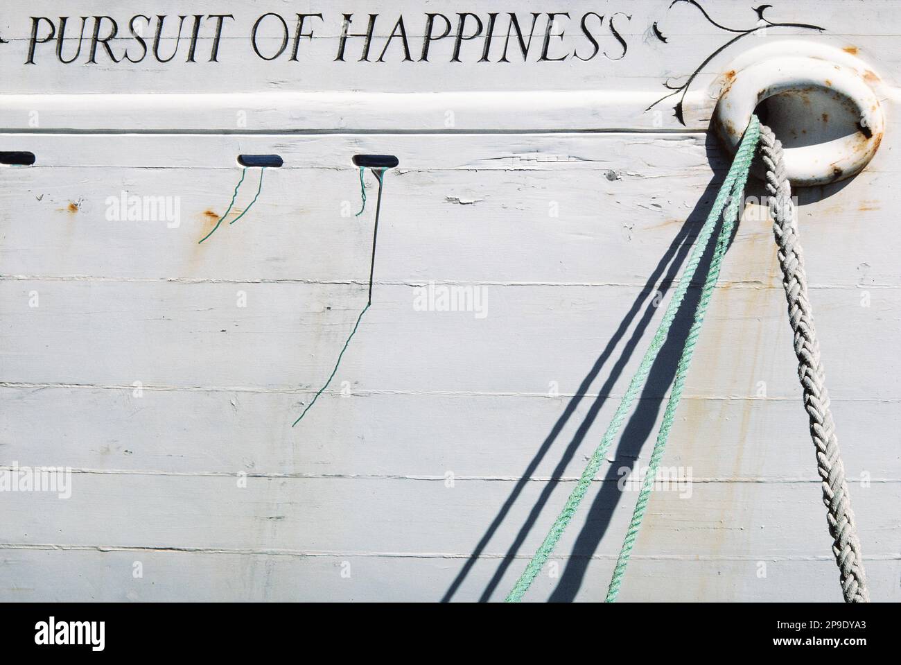 Detail of wooden boat hull and lines with hand painted vessel name in ...
