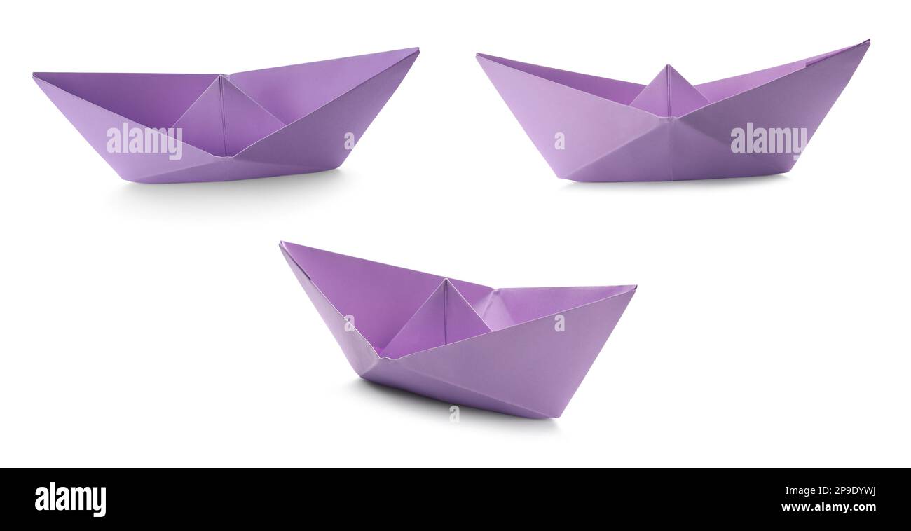 Set with violet paper boats on white background Stock Photo - Alamy