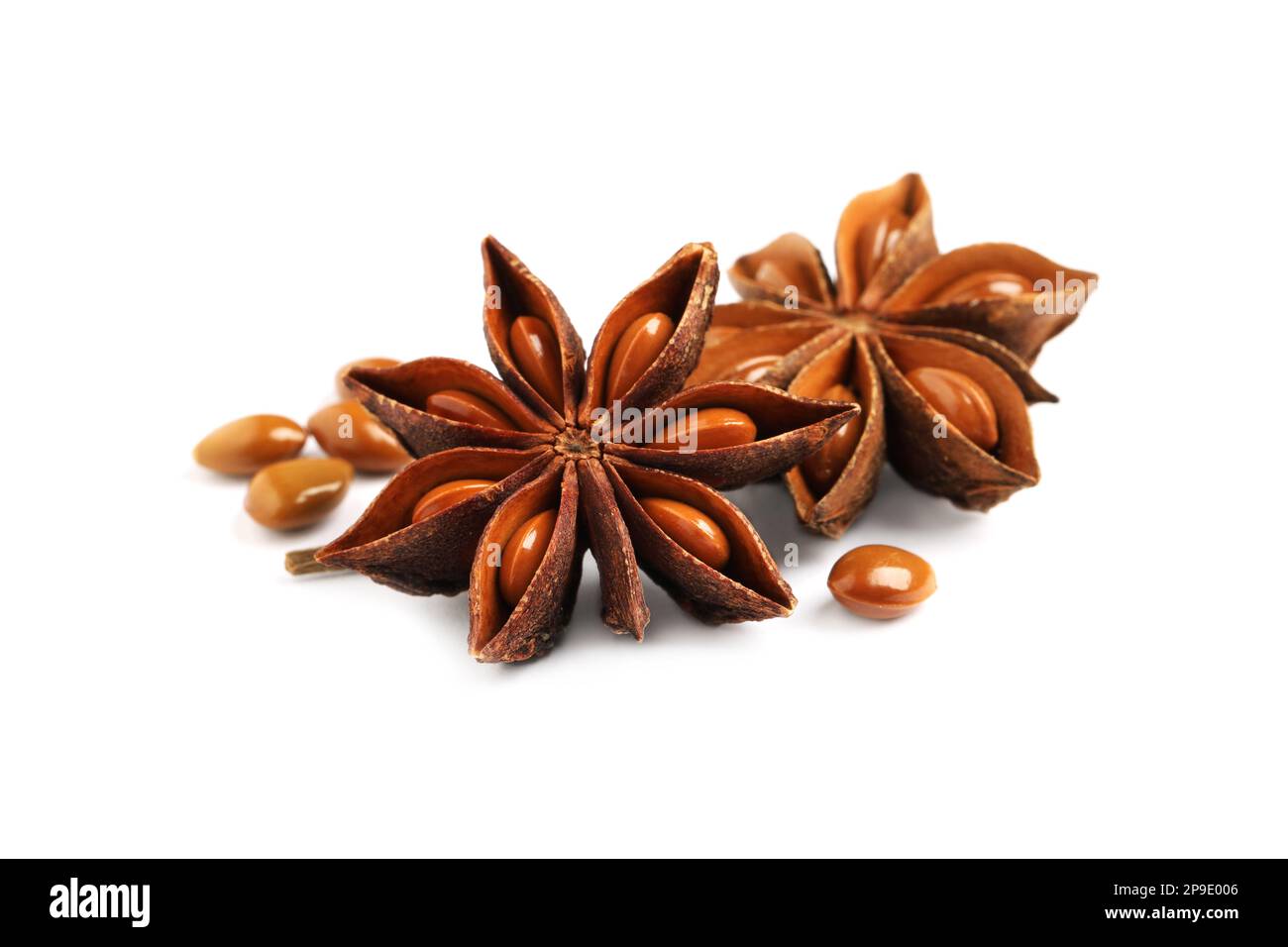 Dry anise stars with seeds on white background Stock Photo - Alamy