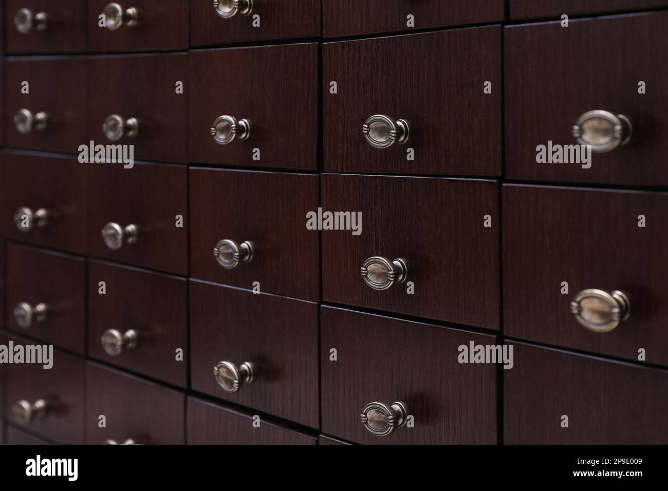 Library catalog. Wooden chest of drawers, closeup Stock Photo - Alamy
