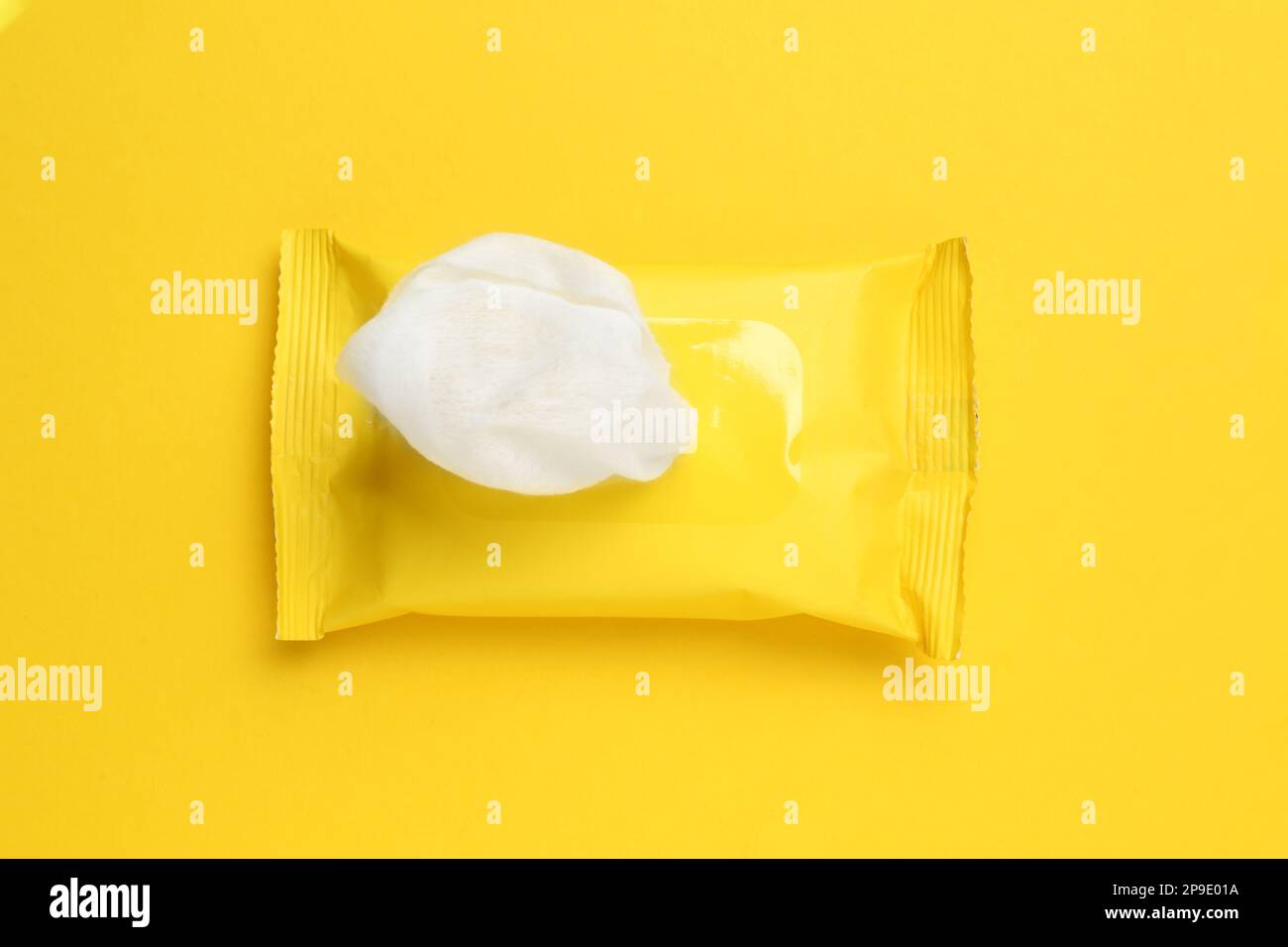 Wet wipes flow pack on yellow background, top view Stock Photo - Alamy