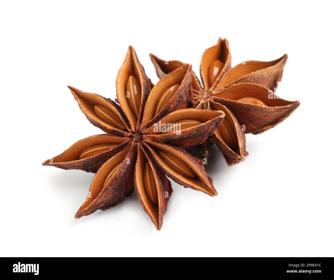 Dry anise stars with seeds on white background Stock Photo - Alamy
