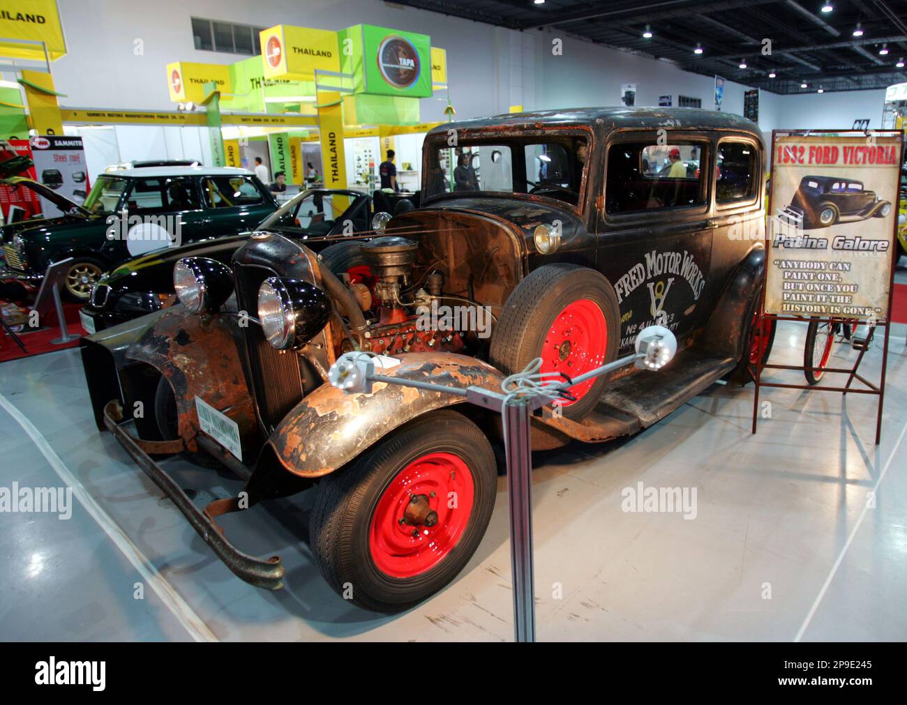 A 1932 Ford Victoria is on display together with other modern cars ...