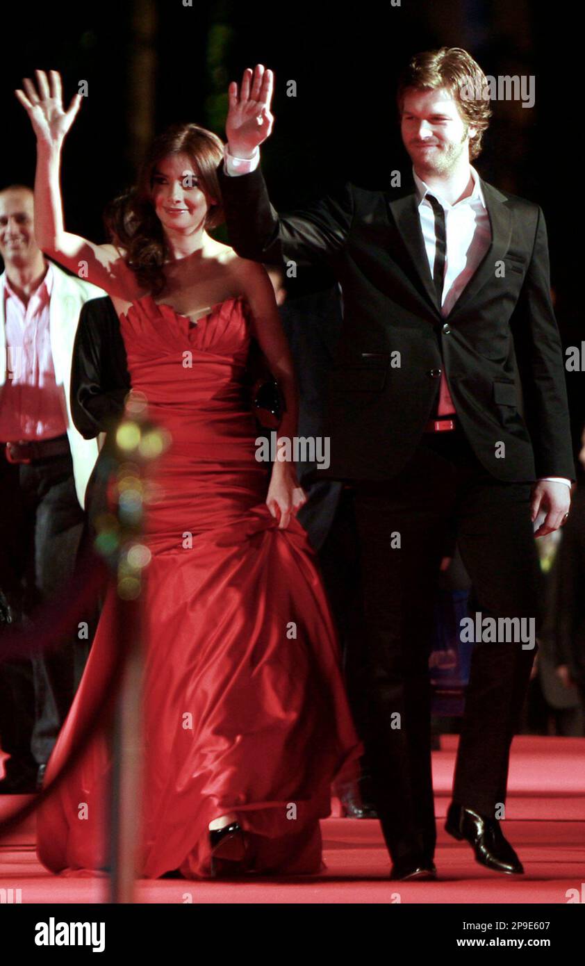 Turkish actors Kivanc Tatlitug , right, and Songul Oden, left, wave to ...