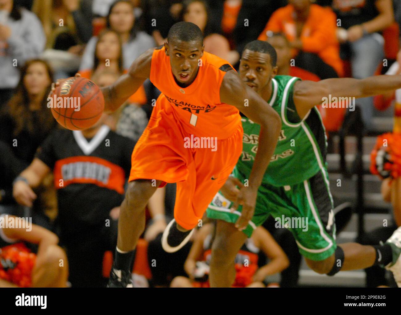 Oklahoma State guard Terrel Harris, left, is chased by North Texas ...