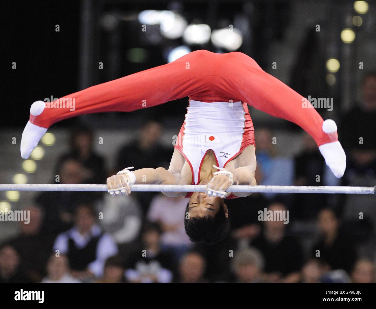 Japan's Hisashi Mizutori performs on the horizontal bar on his way to ...