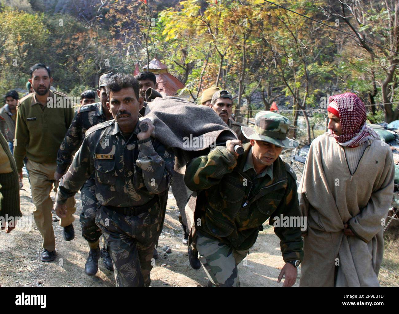 Indian army soldiers carry dead body of a victim after a bridge ...