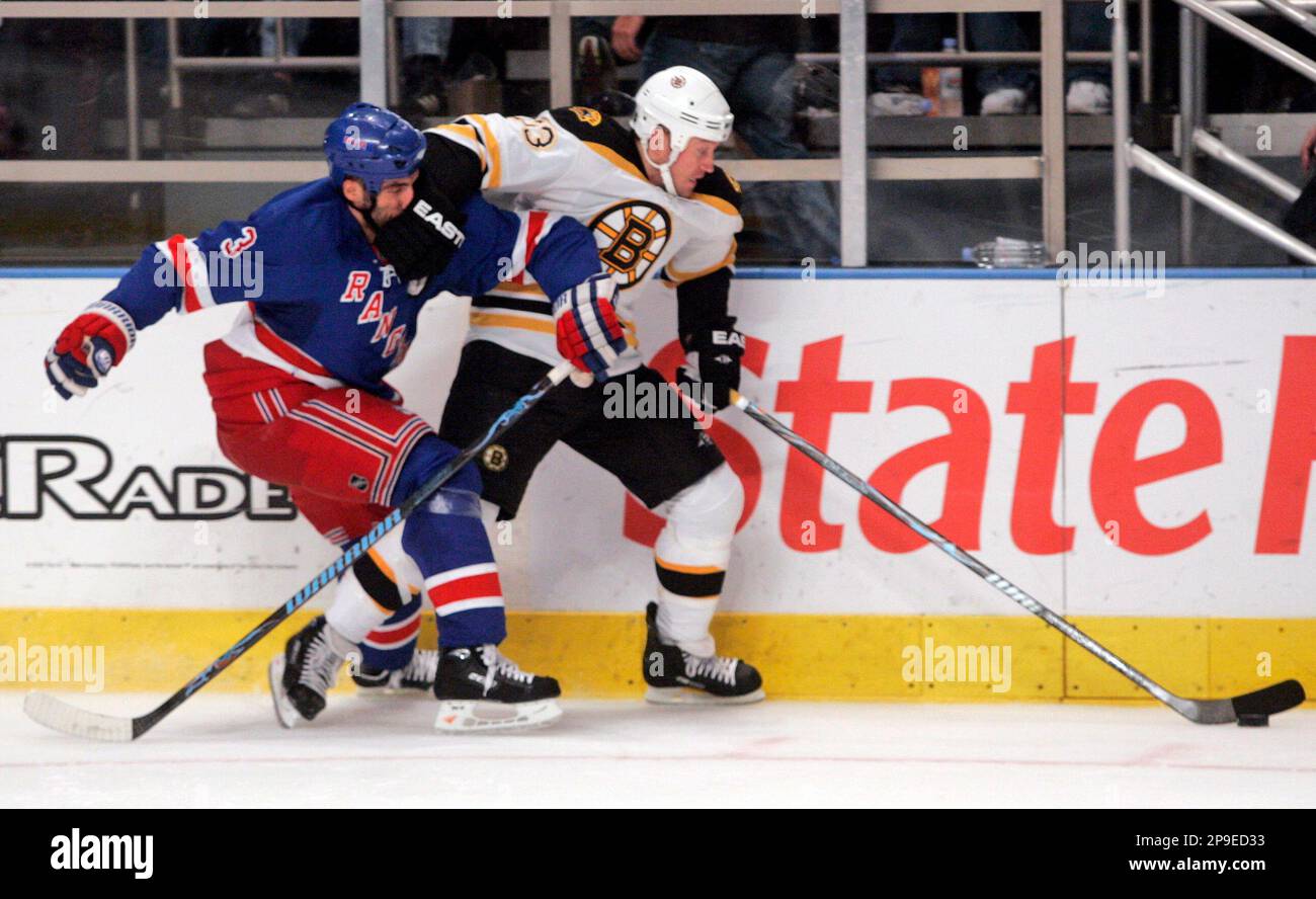 Boston Bruins' Michael Ryder (73) fights for the puck with New York ...
