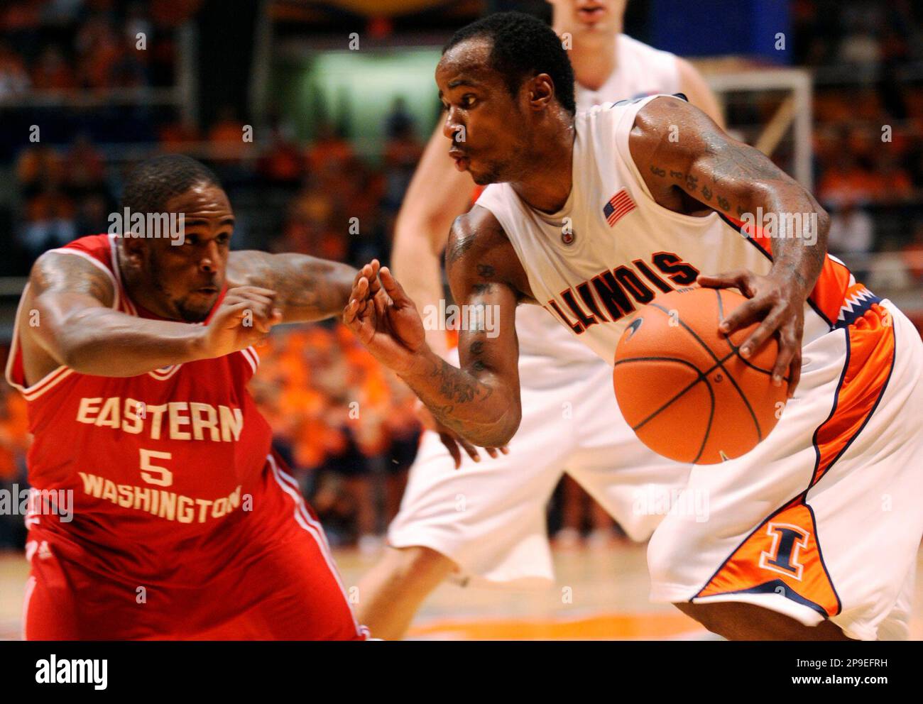 Illinois' Chester Frazier, right, drives past Eastern Washington's ...