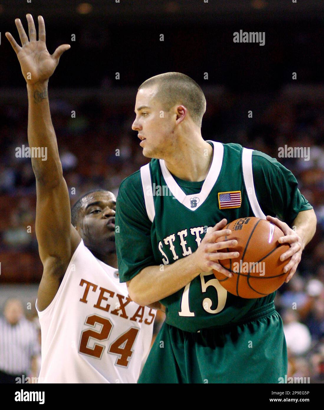 Texas guard Justin Mason, left, defends against Stetson guard Mark ...